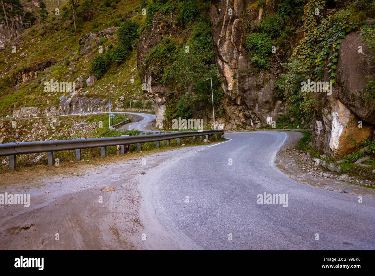 View from hilly mountain road travelling through Himalayas mountains ...