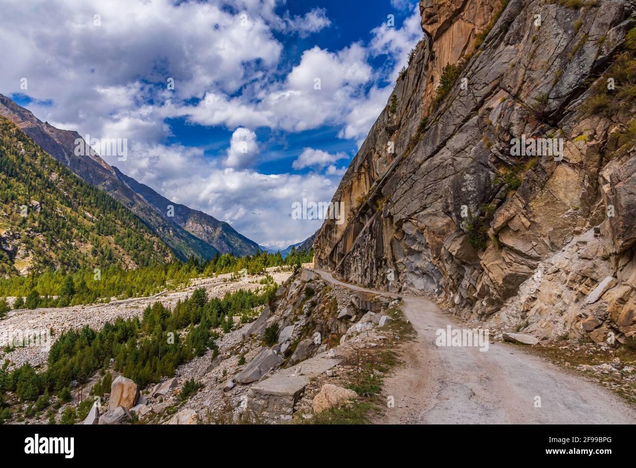 View from hilly mountain road travelling through Himalayas mountains ...