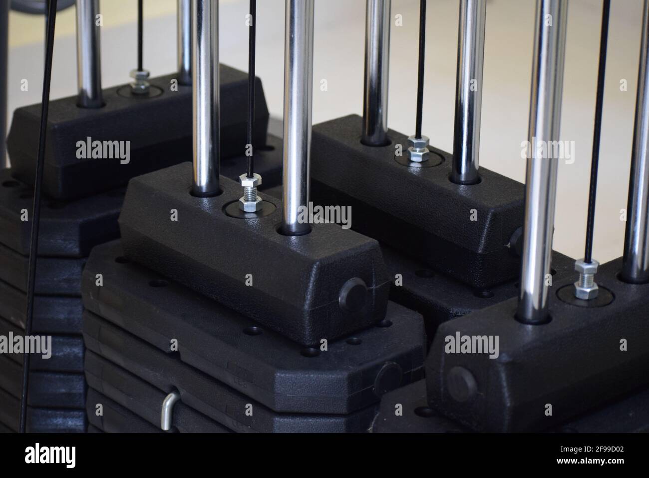 Closeup shot of steel weight stack - gym equipment Stock Photo - Alamy