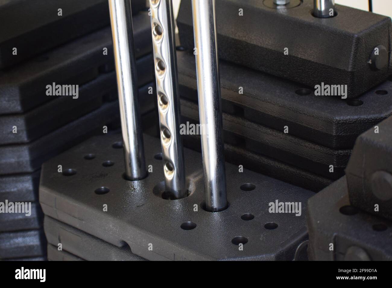 Closeup shot of steel weight stack - gym equipment Stock Photo - Alamy