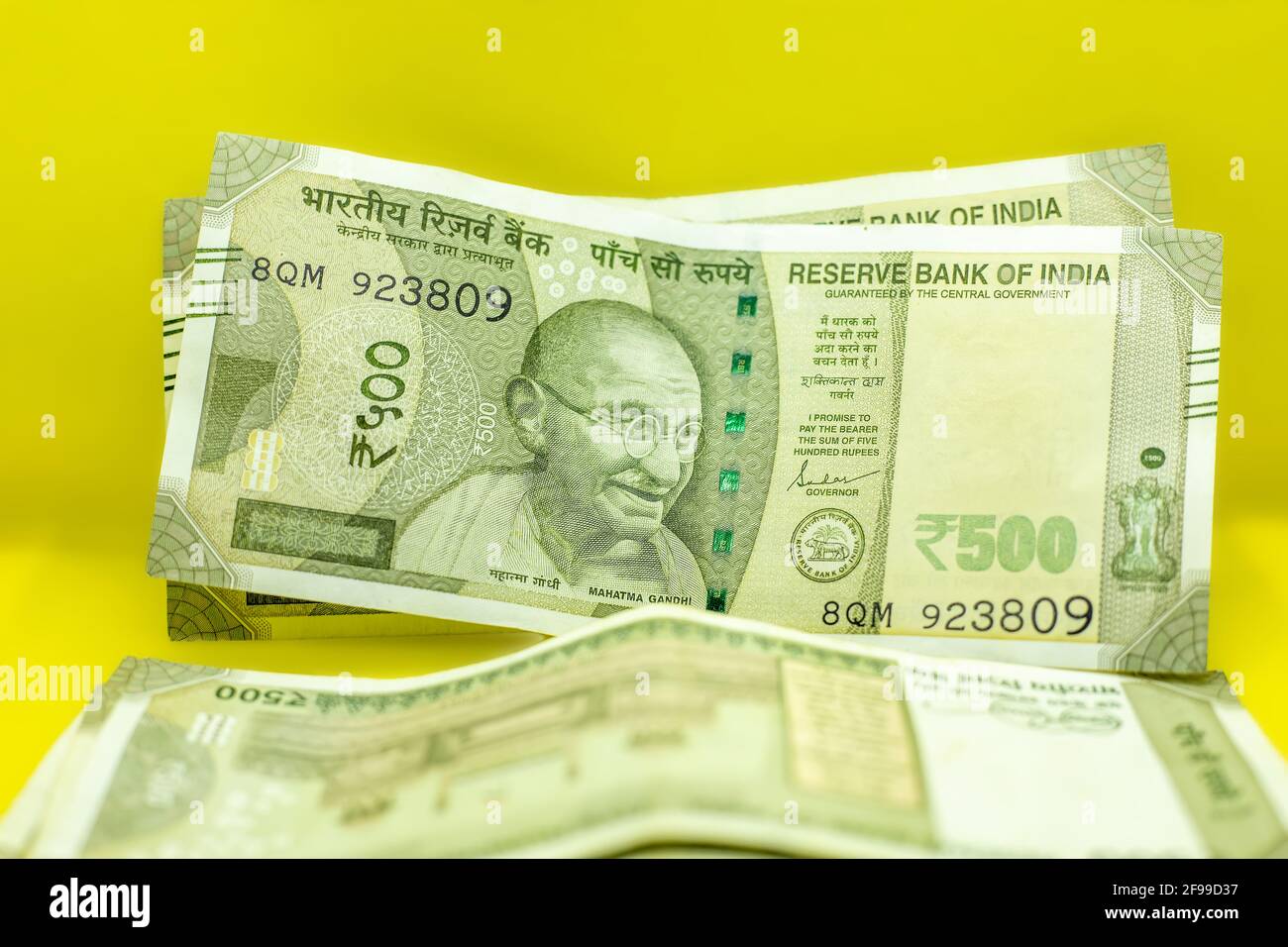 Closeup of Indian 500 Rupee notes on vibrant yellow background Stock ...