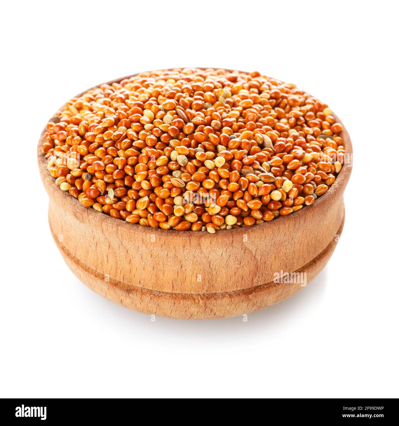 Bowl with dry millet on white background Stock Photo - Alamy
