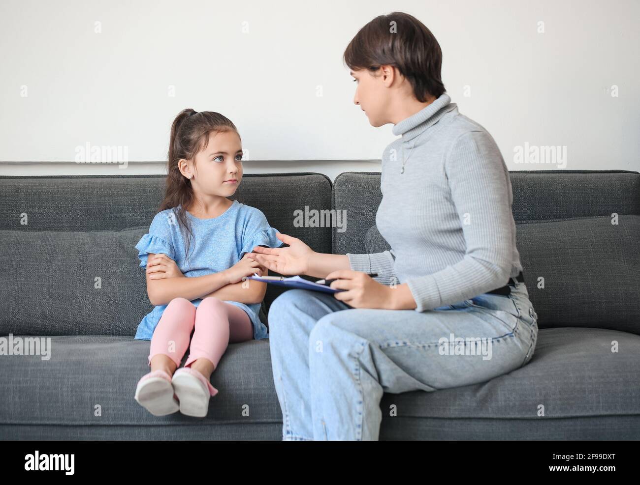 Female psychologist working with little girl in office Stock Photo - Alamy