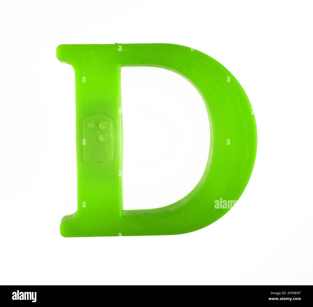 Plastic letter D of the English alphabet against white background, top ...