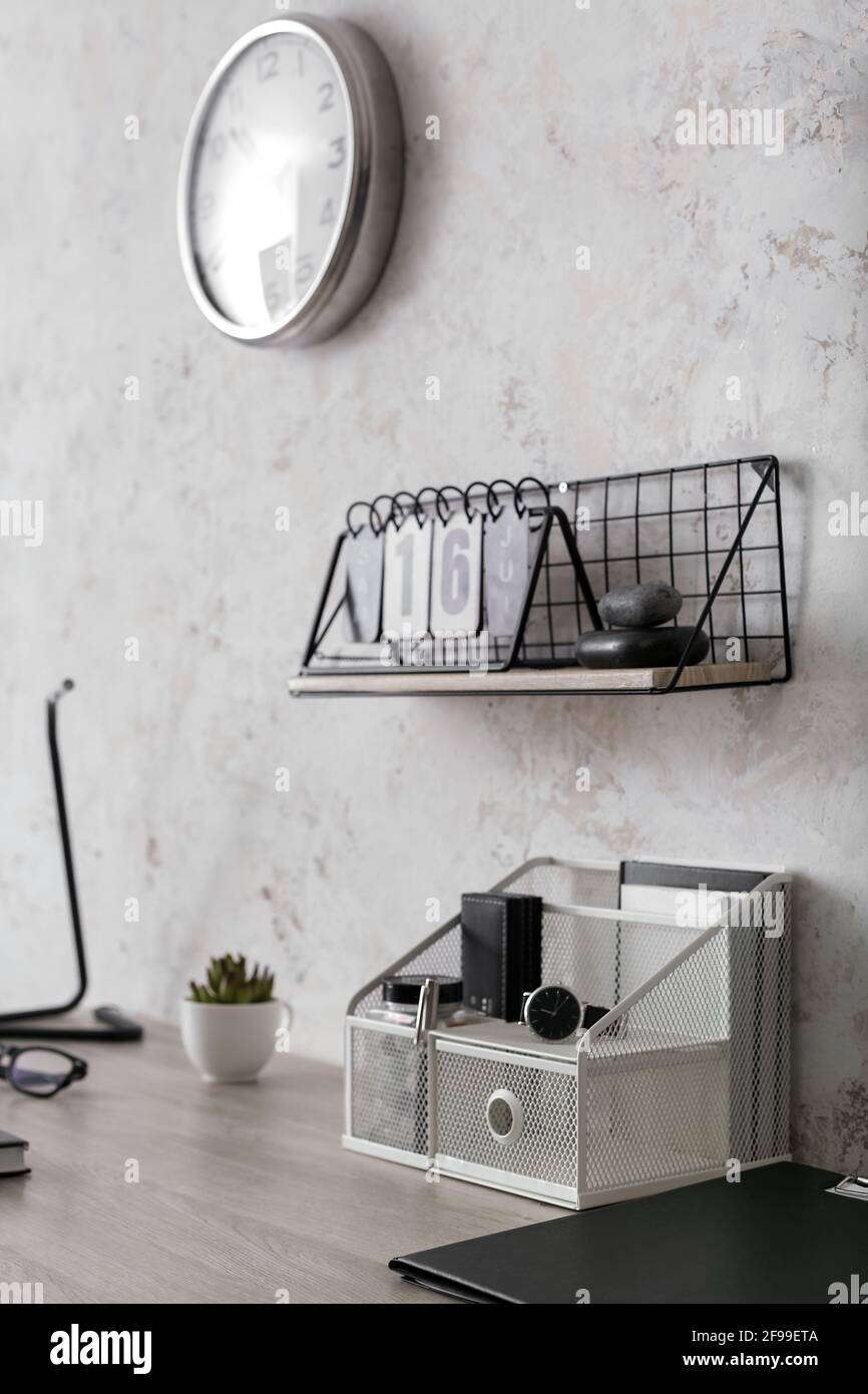 Modern workplace with organizer in room Stock Photo - Alamy
