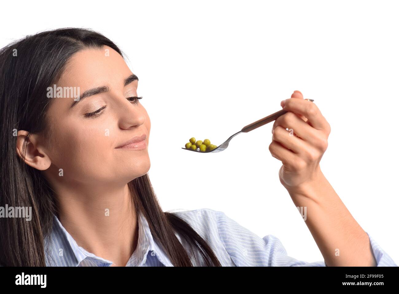Woman eating peas fork hi-res stock photography and images - Alamy
