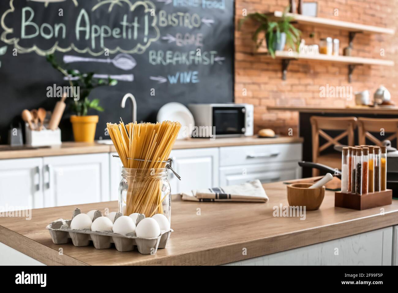 Counter with food in modern interior of kitchen Stock Photo - Alamy