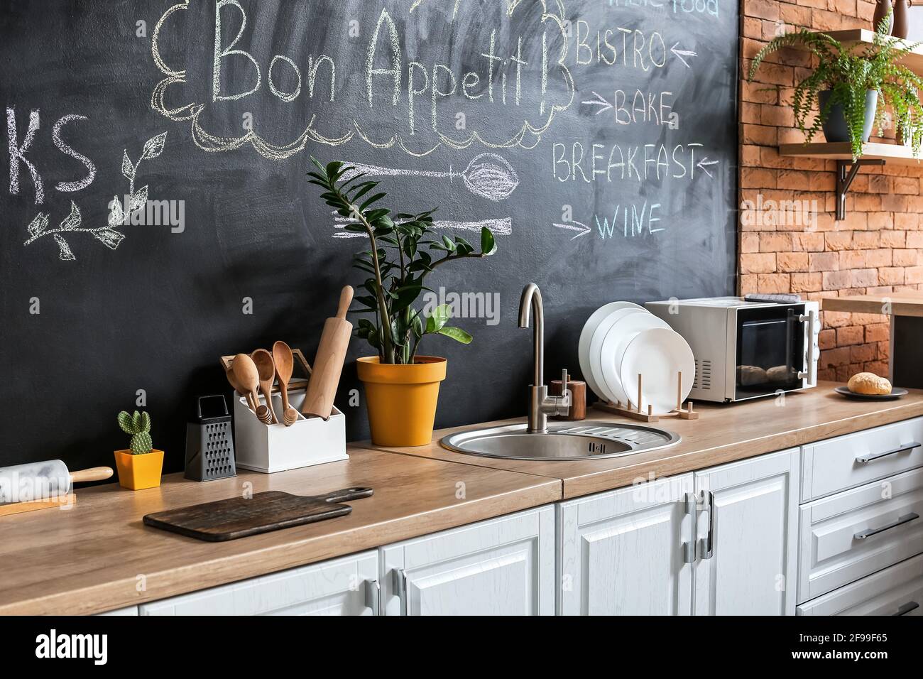 Stylish interior of modern kitchen in restaurant Stock Photo - Alamy