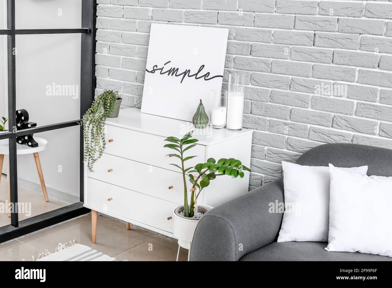 Modern chest of drawers in interior of living room Stock Photo - Alamy