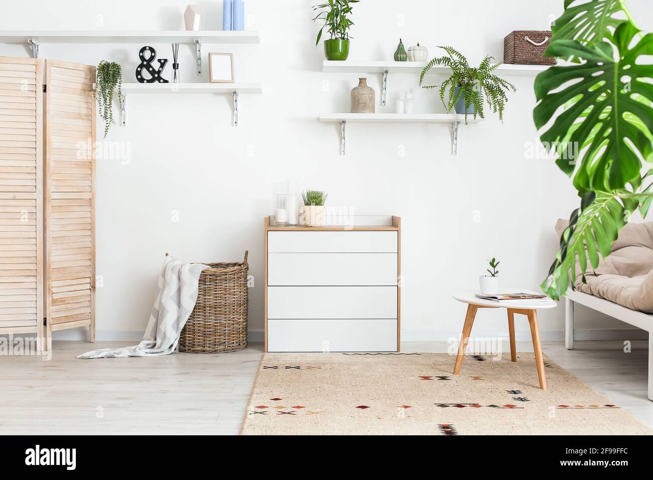Modern living room with chest of drawers Stock Photo - Alamy