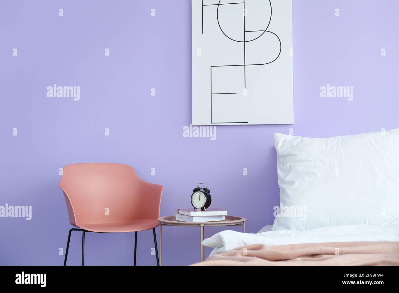 Modern bedside table and chair in interior of bedroom Stock Photo - Alamy