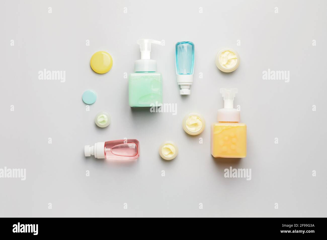 Composition with bottles of cosmetic products on light background Stock ...