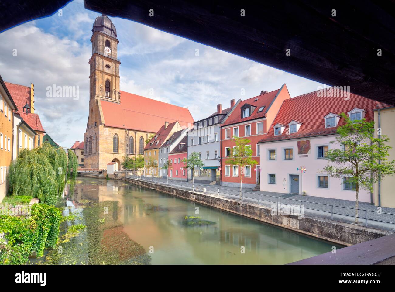Footbridge, river Vils, St. Martins Church, green area, house facade ...