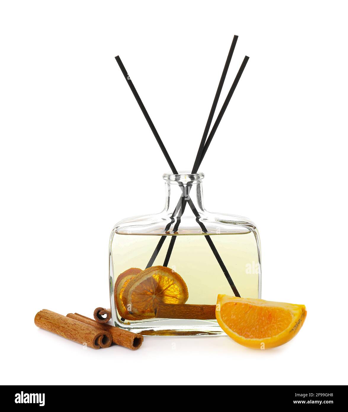 Reed diffuser with cinnamon and orange on white background Stock Photo ...