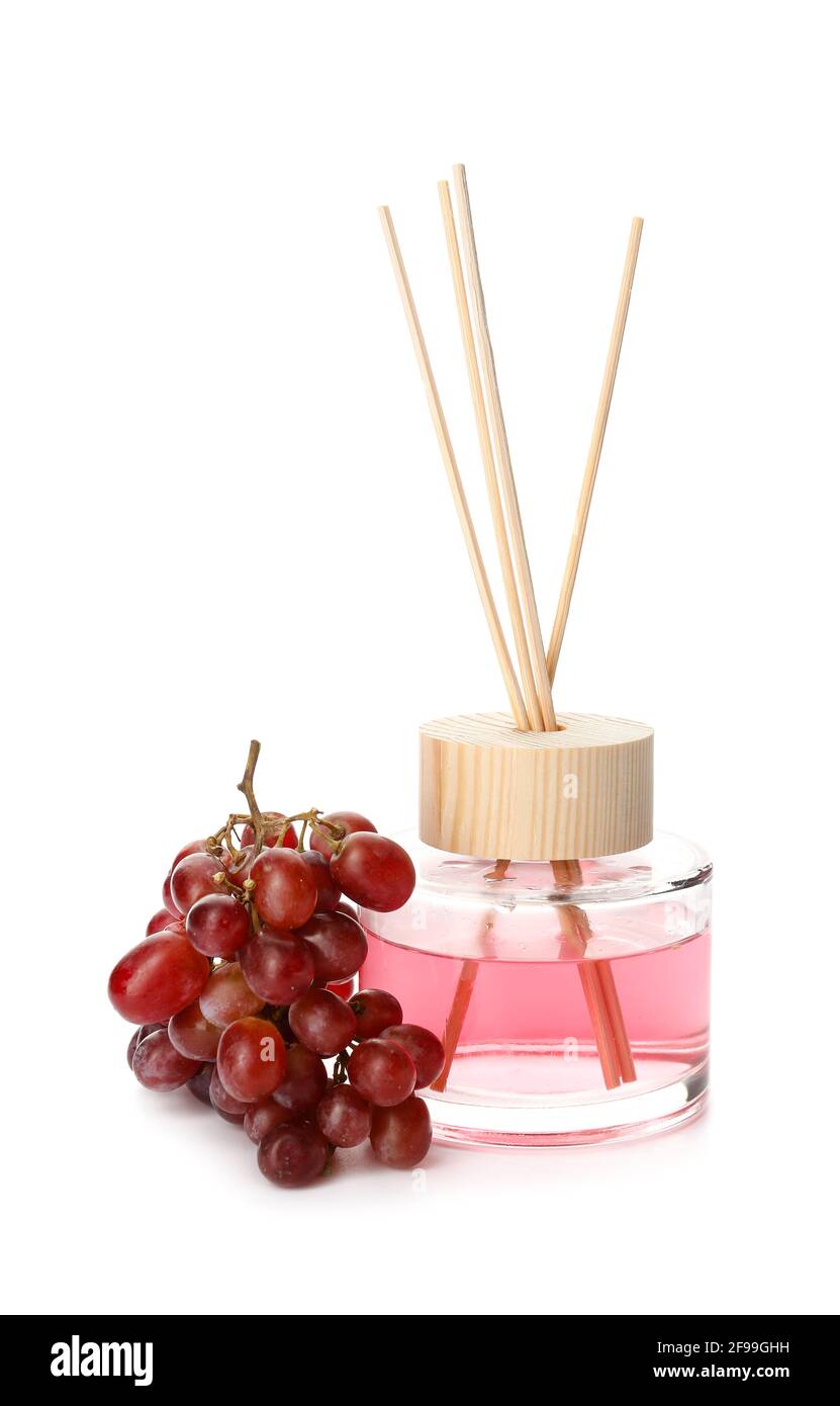 Reed diffuser with grapes on white background Stock Photo - Alamy