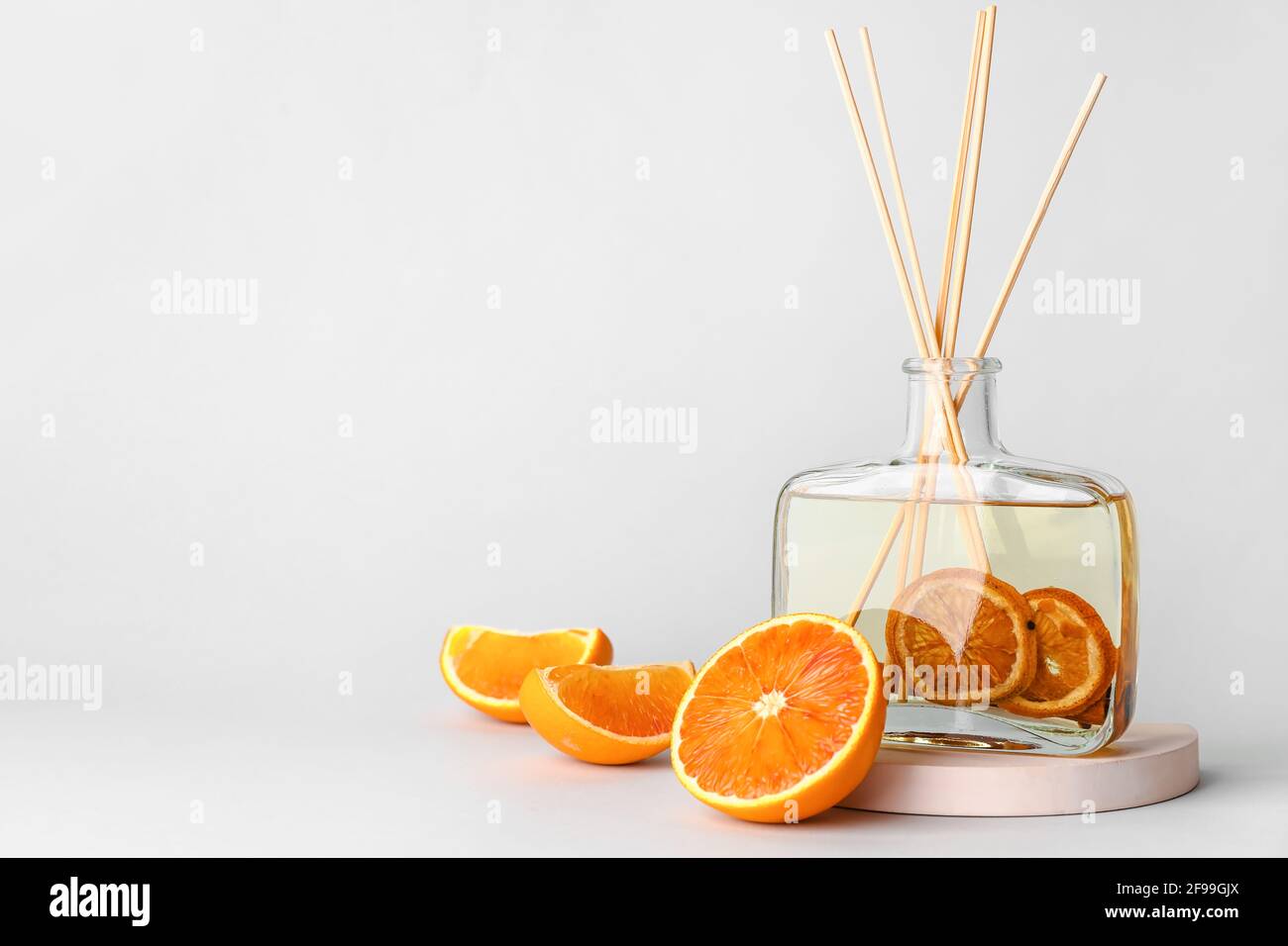 Citrus reed diffuser on white background Stock Photo - Alamy