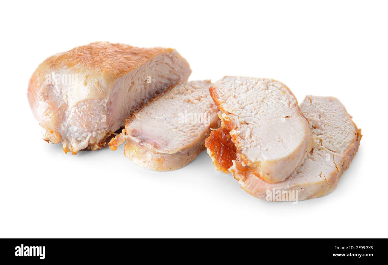 Cut roasted chicken fillet on white background Stock Photo - Alamy