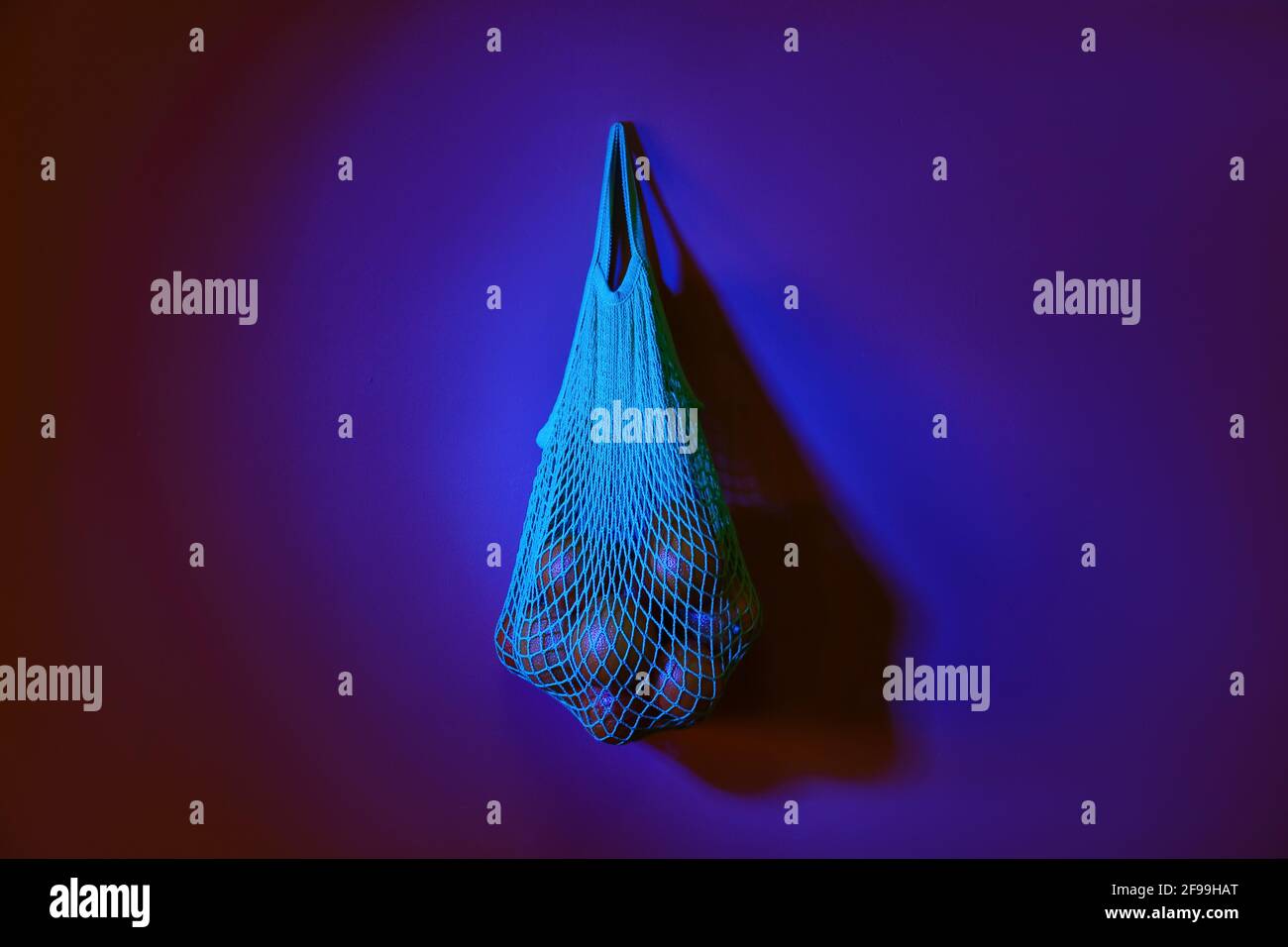 Eco bag with oranges on dark color background Stock Photo - Alamy