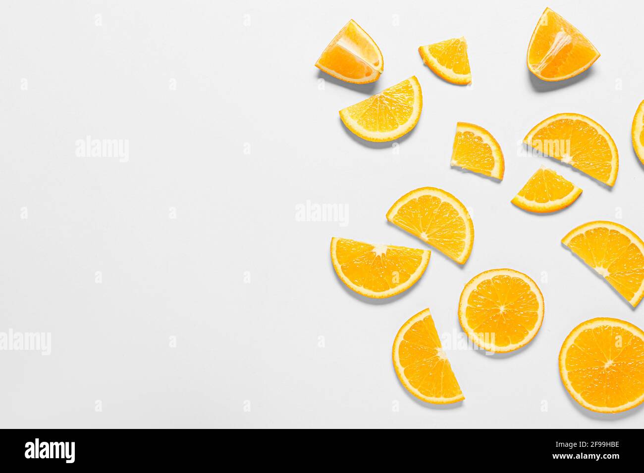 Tasty orange slices on white background Stock Photo - Alamy