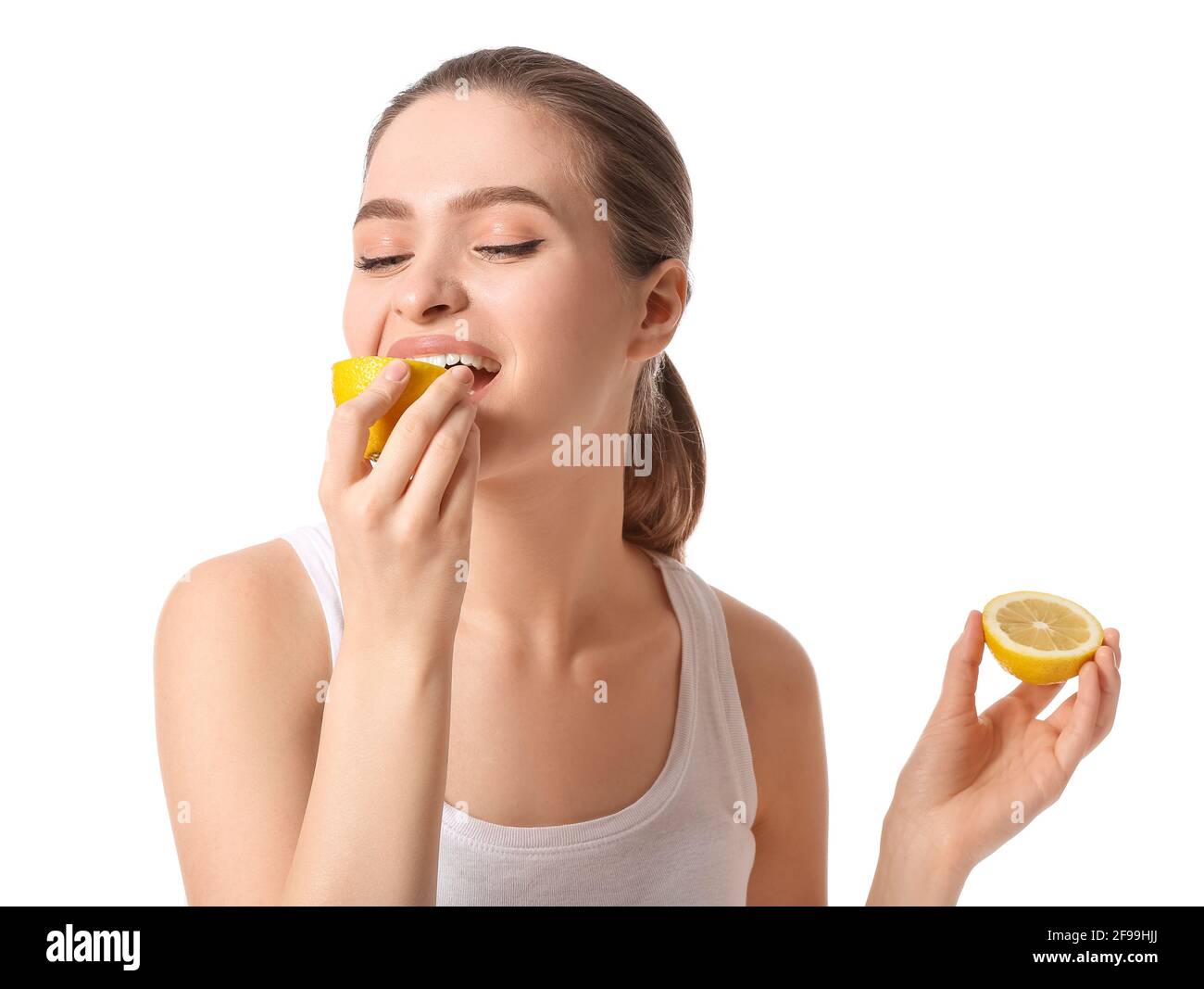 Girl biting lemon hi-res stock photography and images - Alamy