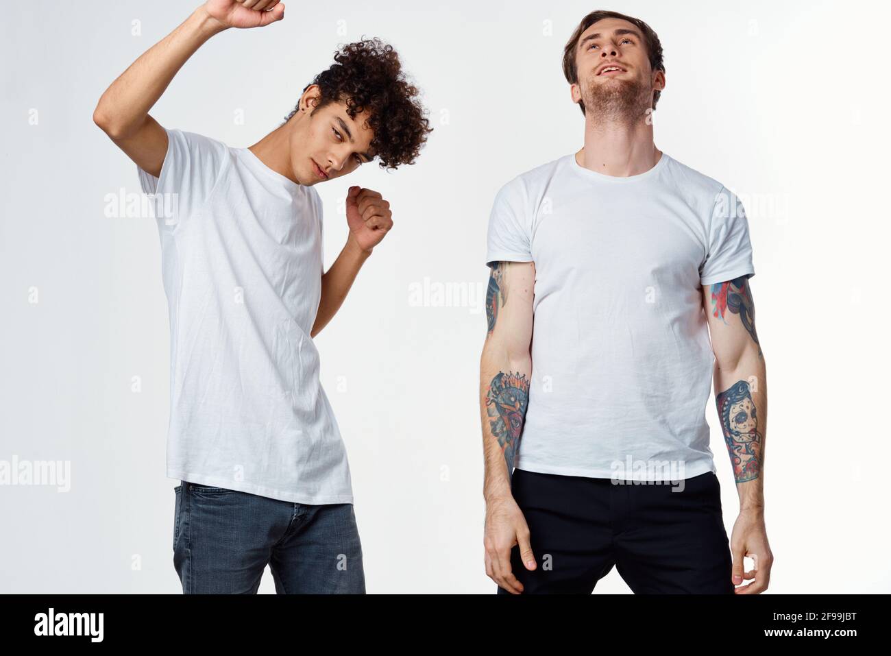 two joyful men friendship emotions communication studio Stock Photo - Alamy