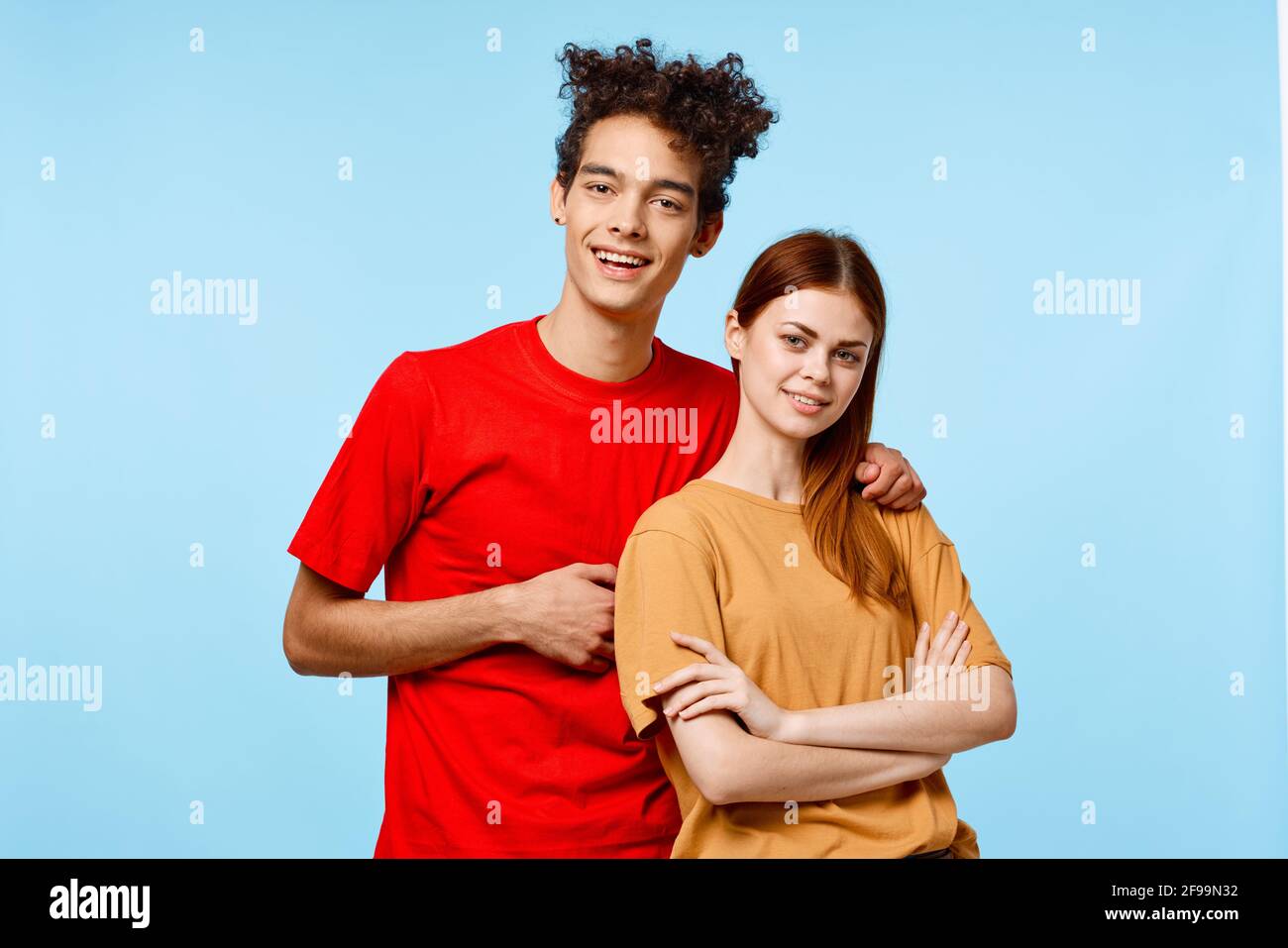 young couple cropped view studio blue background communication Stock ...
