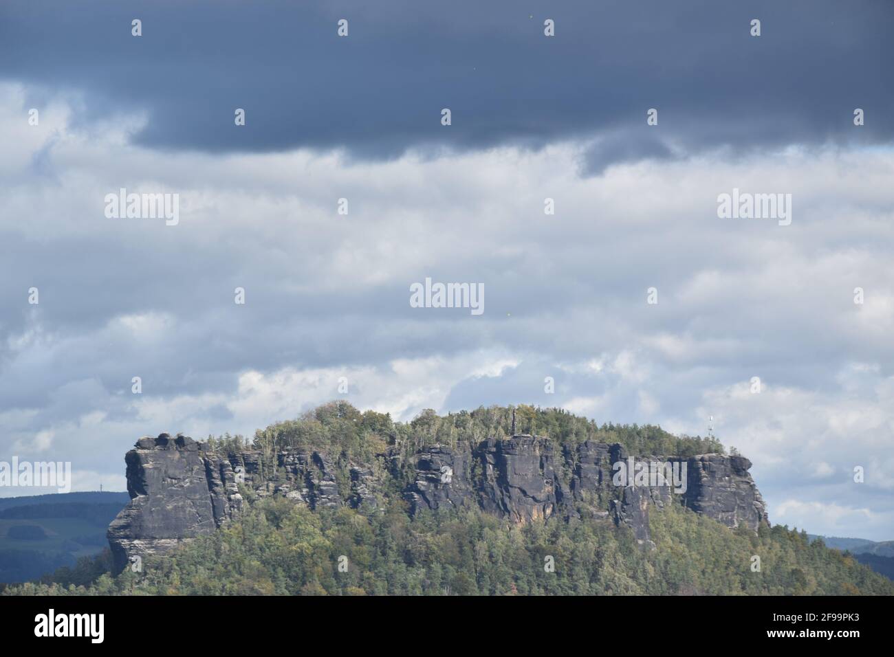 Beautiful view of high rocks on the cloudy sky background Stock Photo ...