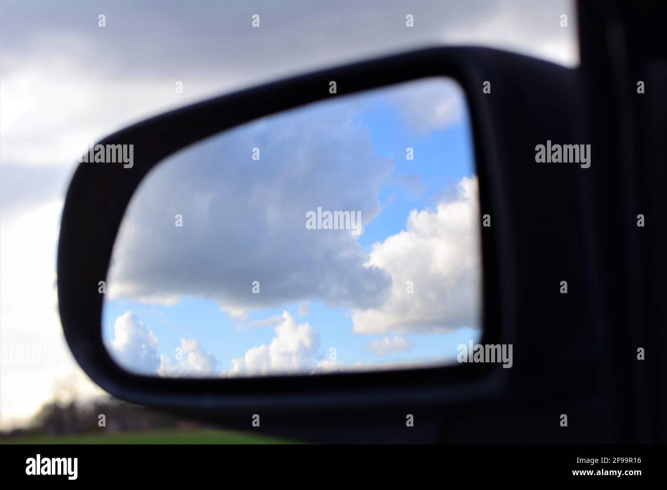 A Cloudy sky is reflected in the exterior mirror of a car Stock Photo ...
