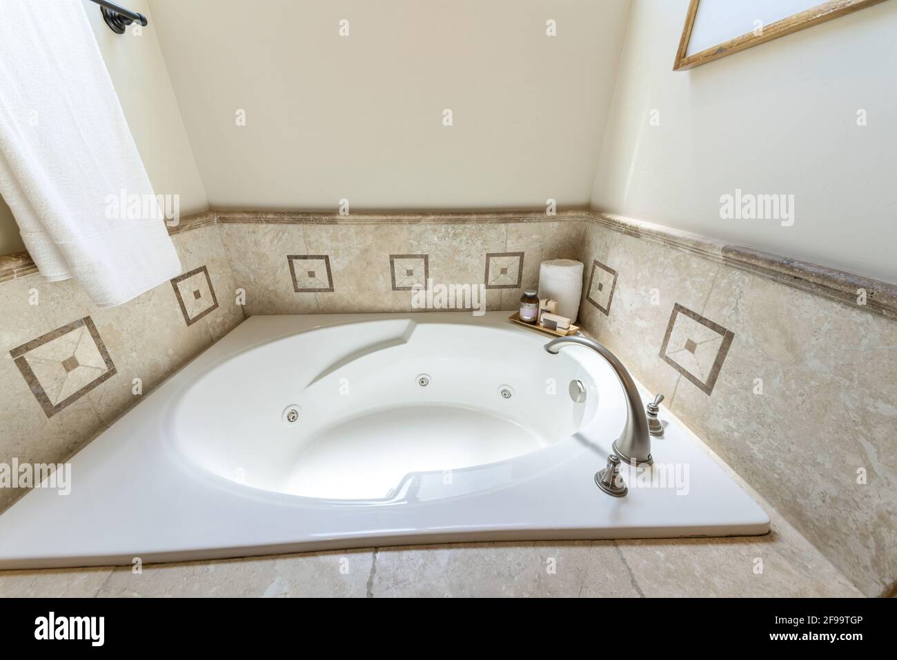 Modern interior of a bathroom with a big bathtub Stock Photo - Alamy