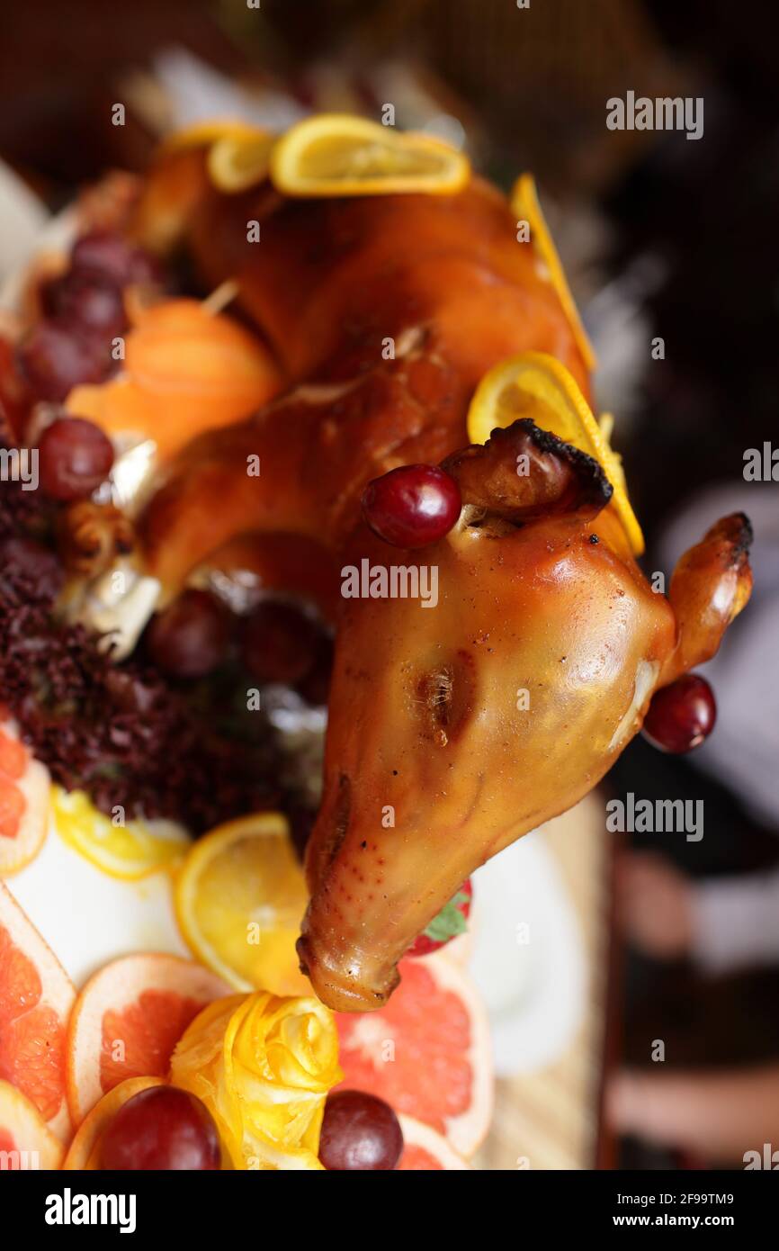 Roasted pig on a table in a restaurant Stock Photo - Alamy