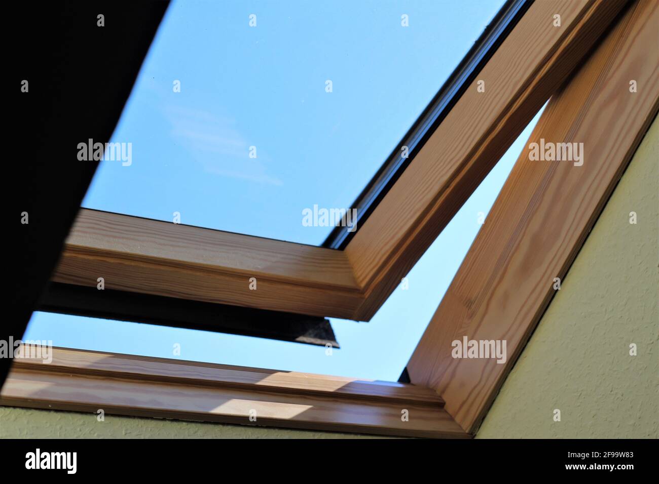 An open wooden roof window at daytime Stock Photo - Alamy