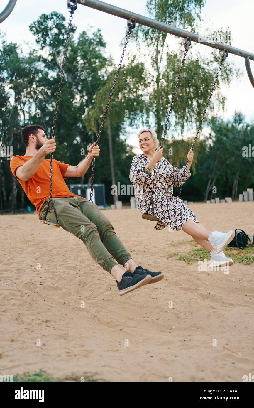 Romantic couple is having fun outside. Enjoying spending time together ...
