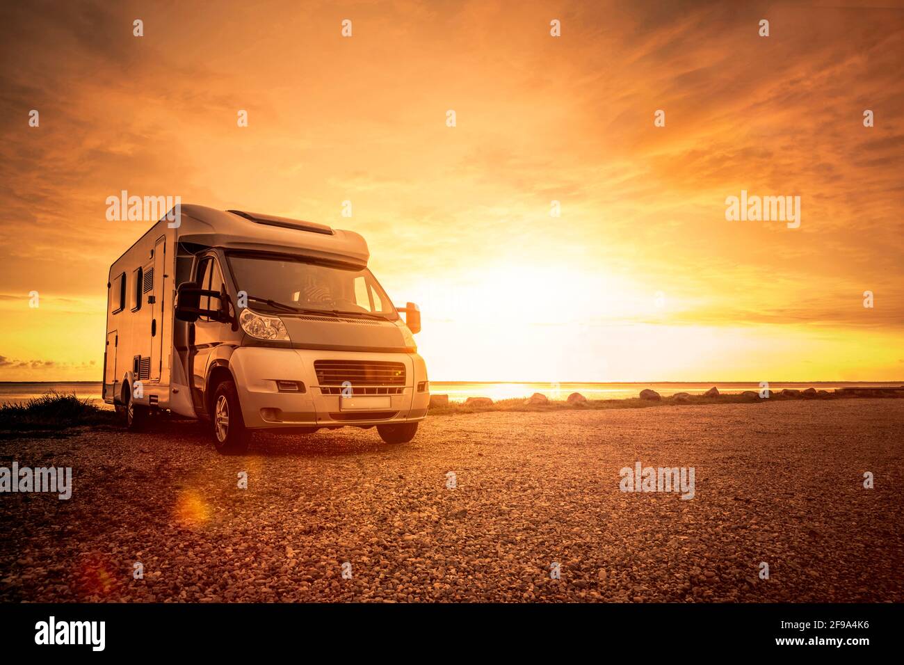 Motorhome at sunset on the beach Stock Photo - Alamy