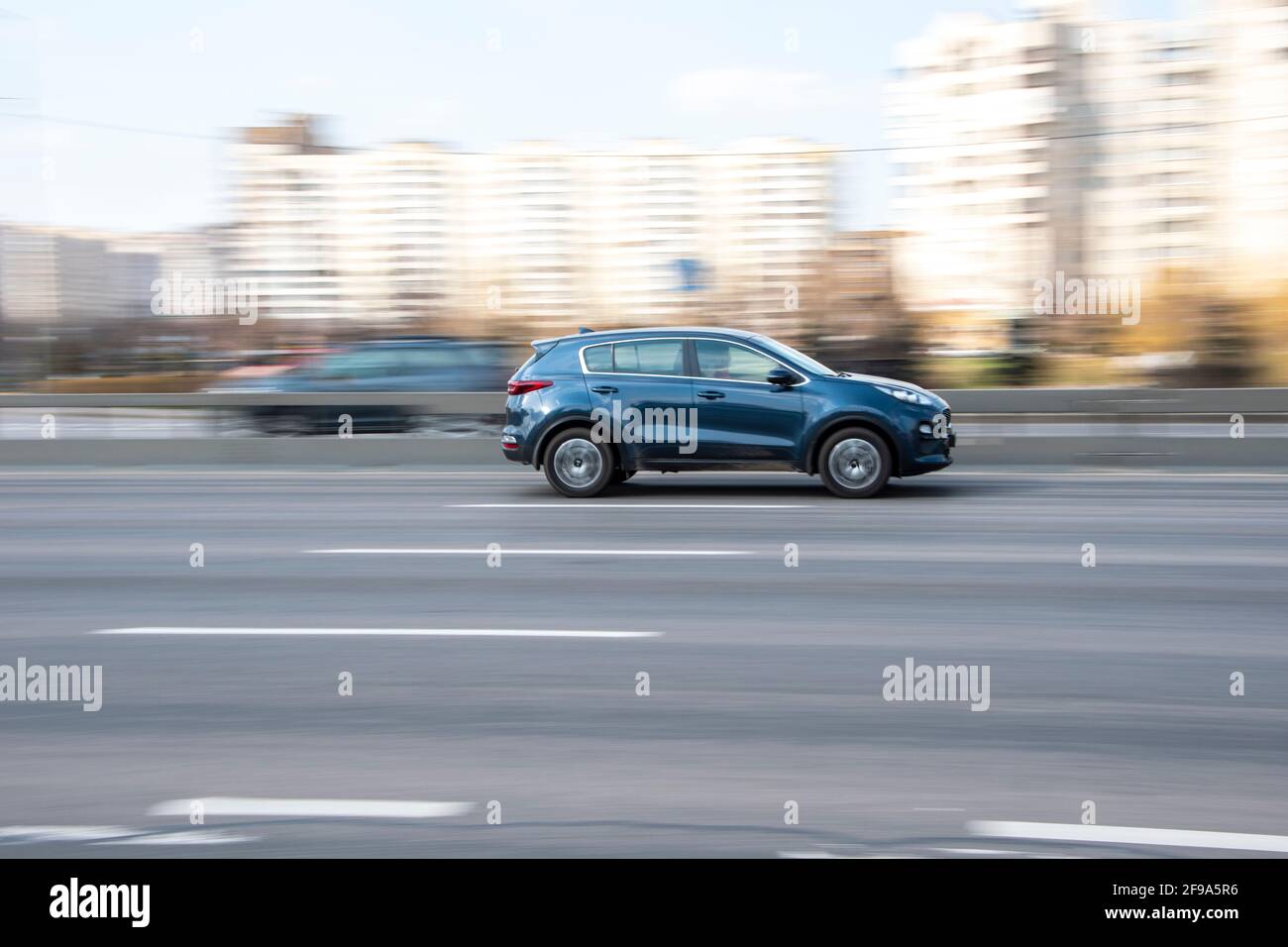 Ukraine, Kyiv - 4 April 2021: Blue KIA Sportage car moving on the ...