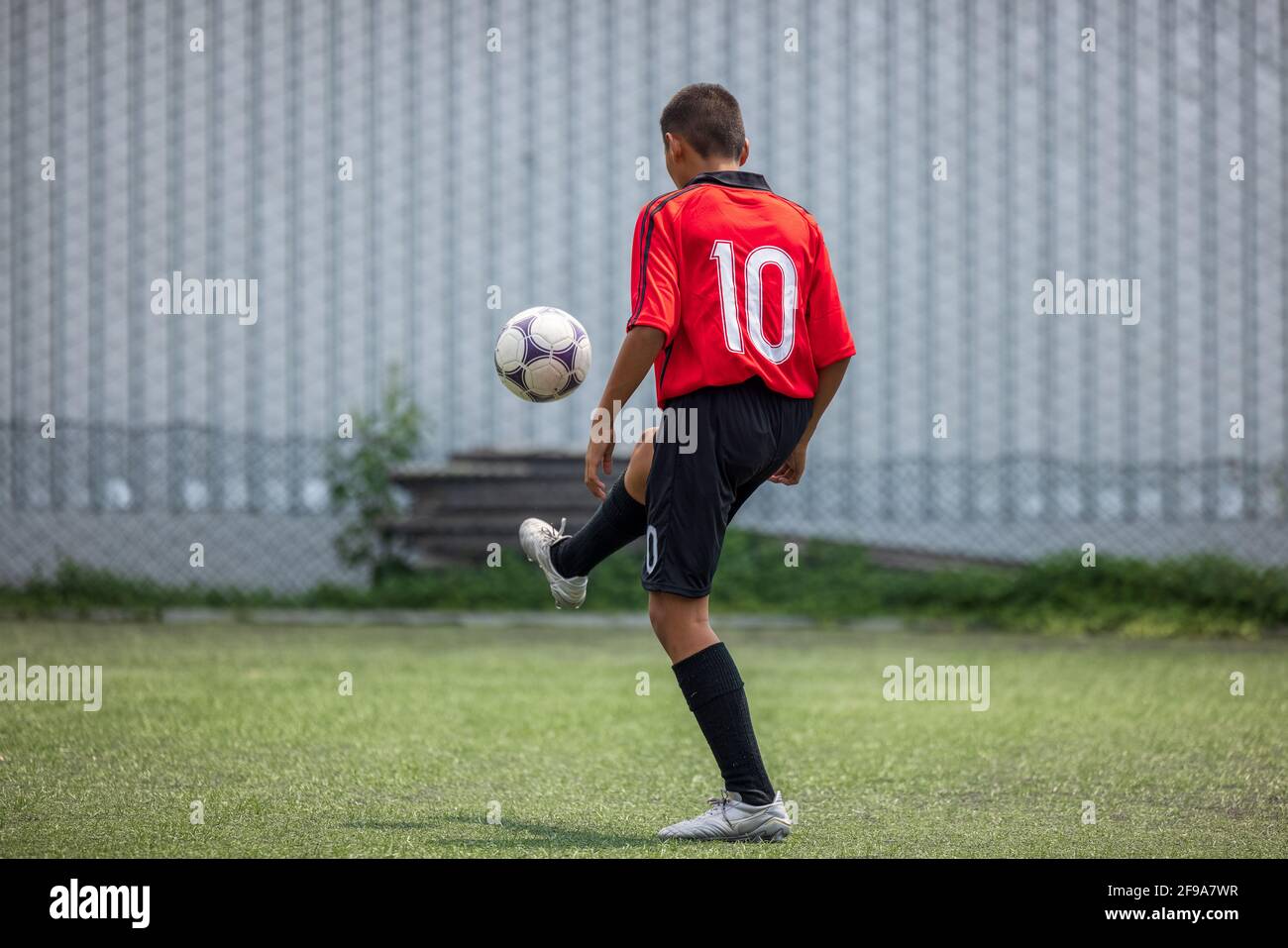 Soccer kid juggling ball hi-res stock photography and images - Alamy