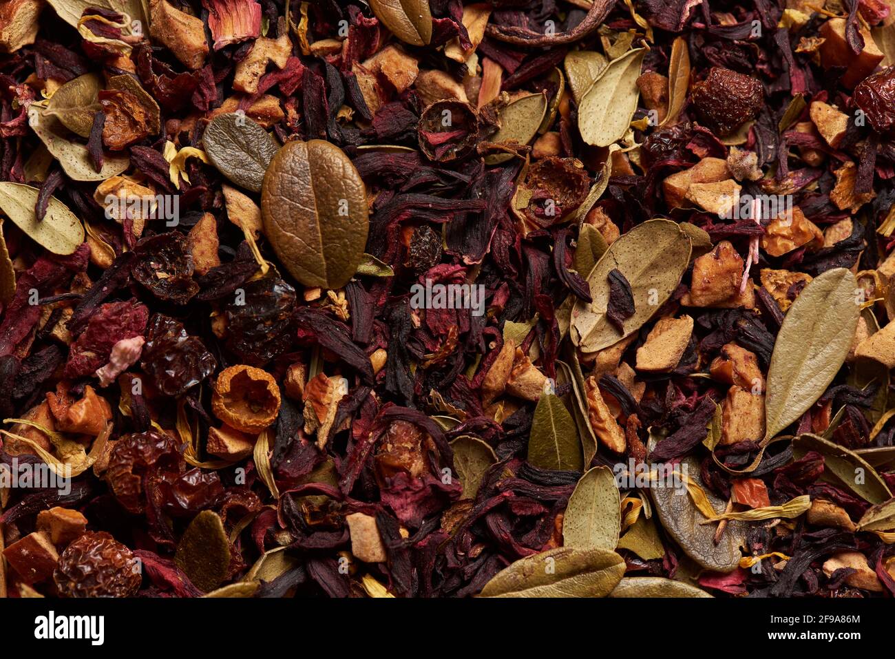 Dried tea leaves with hibiscus as a background Stock Photo - Alamy