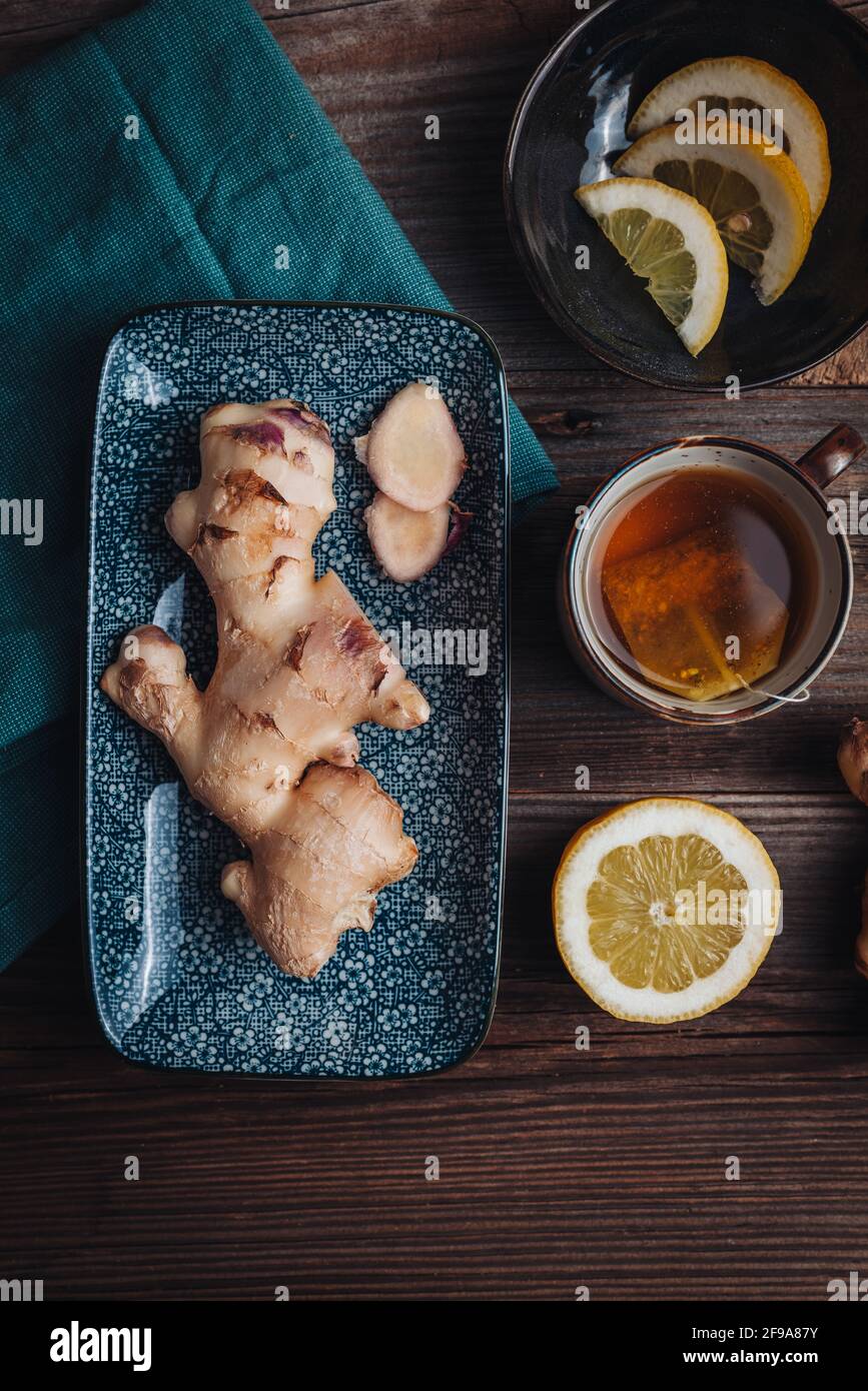 Healthy fresh raw ginger roots with lemon Stock Photo - Alamy
