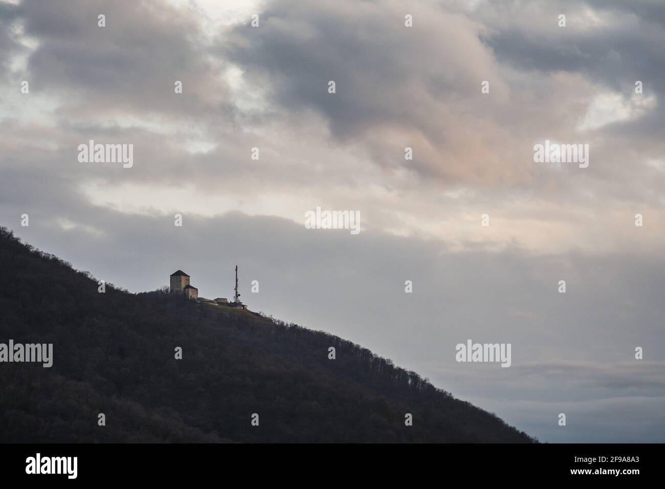 Scenic view of buildings and structures on top of a mountain under a ...