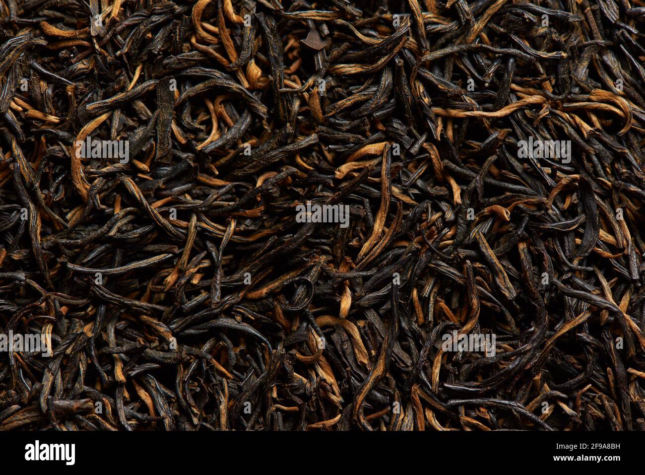 Texture of dry black tea leaves as a background Stock Photo - Alamy