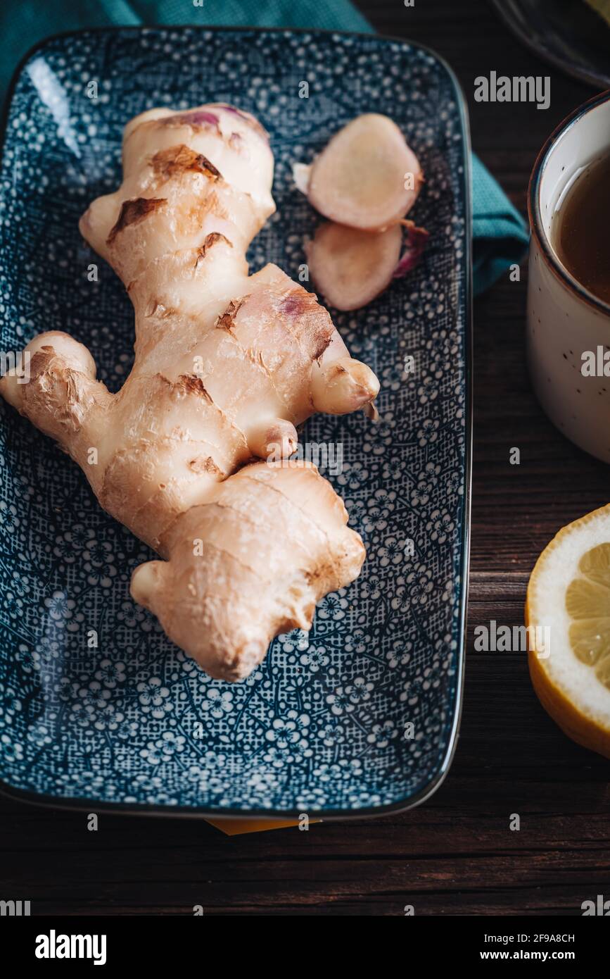 Healthy fresh raw ginger roots with lemon Stock Photo - Alamy