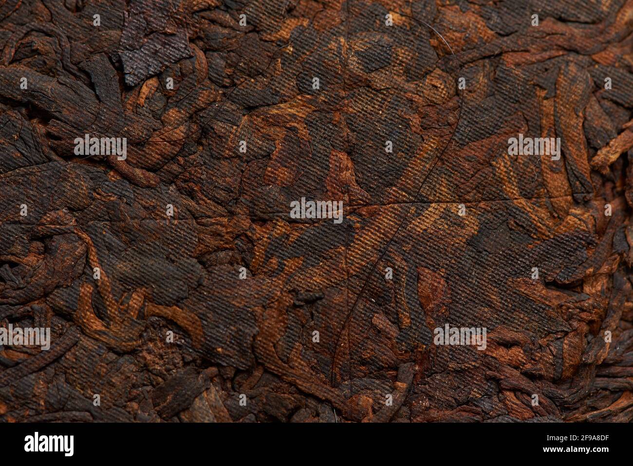 The texture of packaged black tea as a background Stock Photo - Alamy