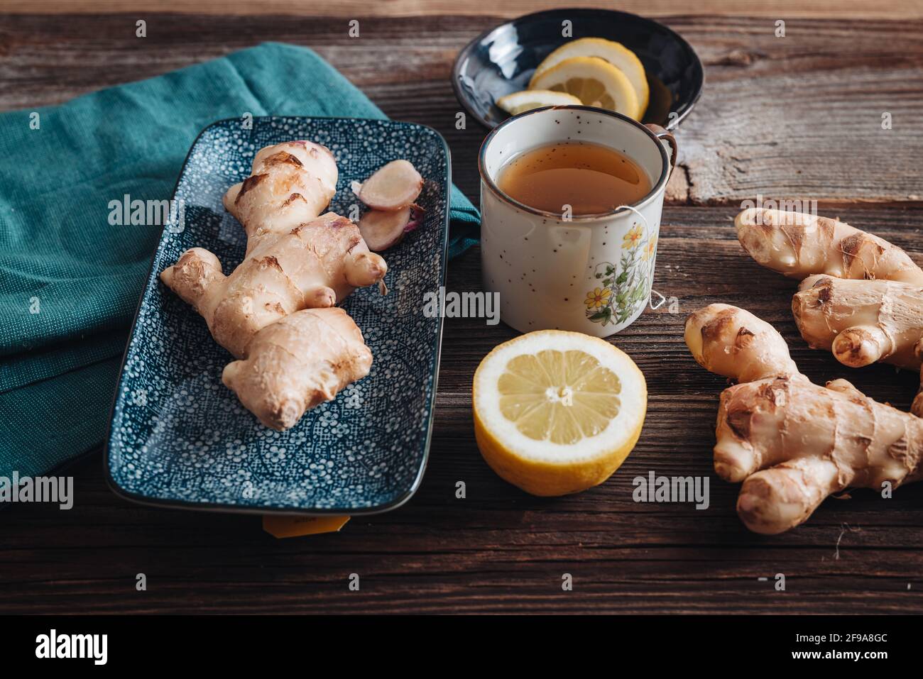 Healthy fresh raw ginger roots with lemon Stock Photo - Alamy