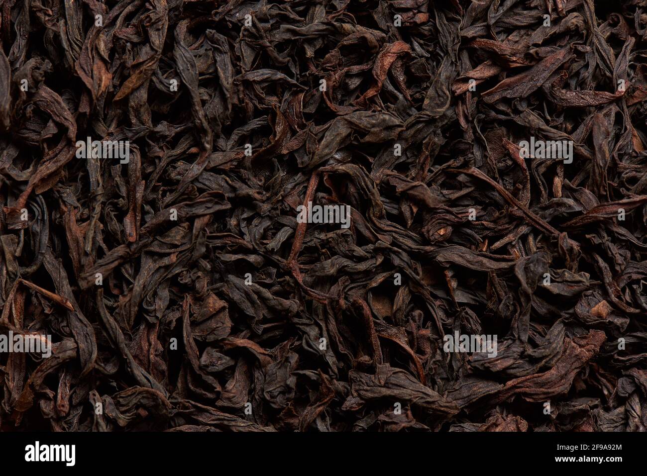 The texture of luxurious black tea as a background Stock Photo - Alamy