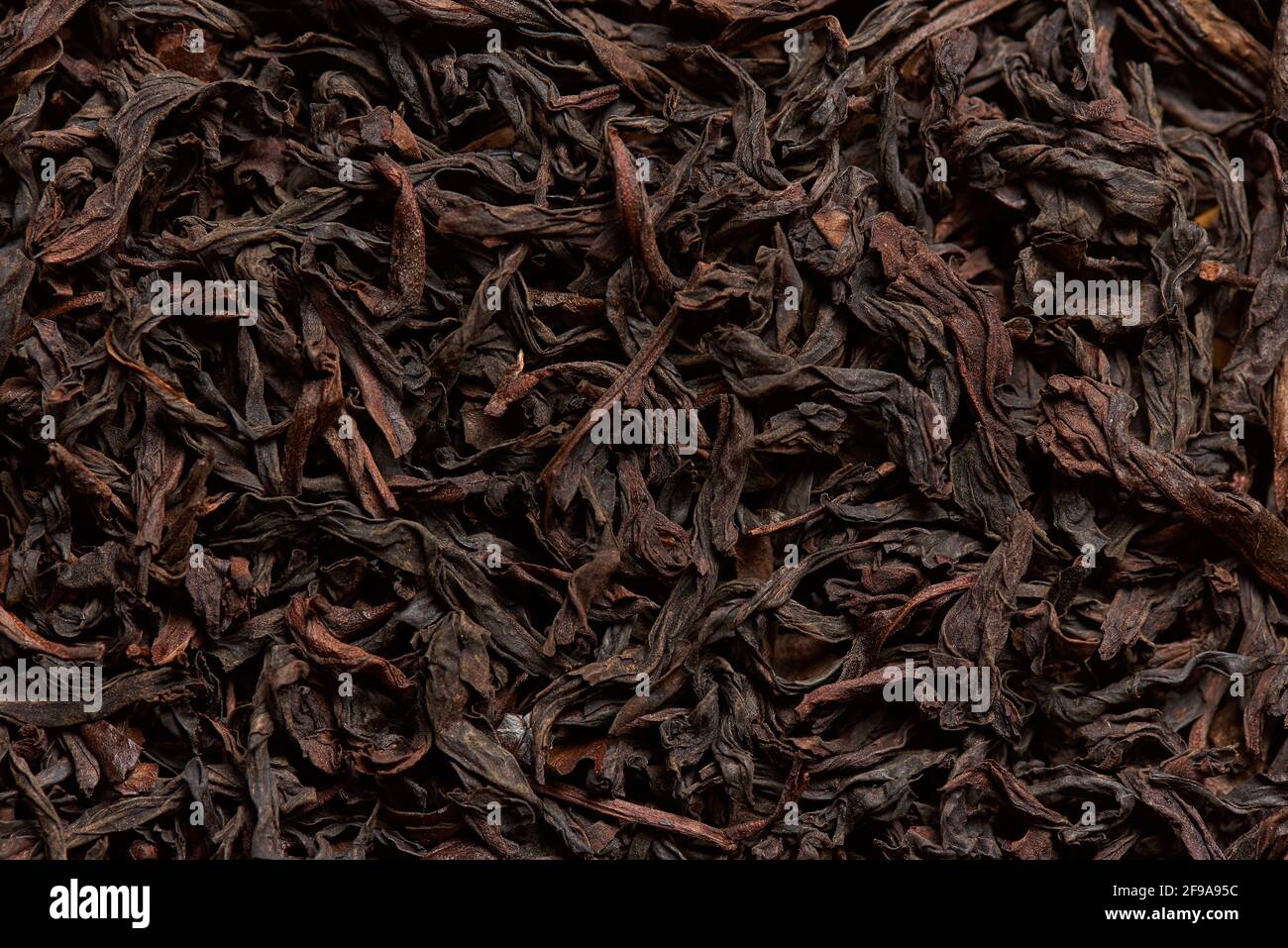 Texture of rich black tea leaves as a background Stock Photo - Alamy