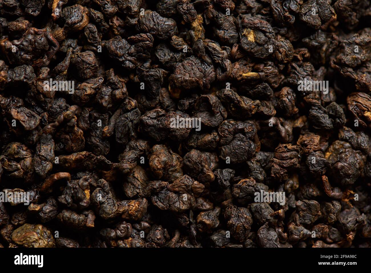 Organic tea leaves texture as a background Stock Photo - Alamy