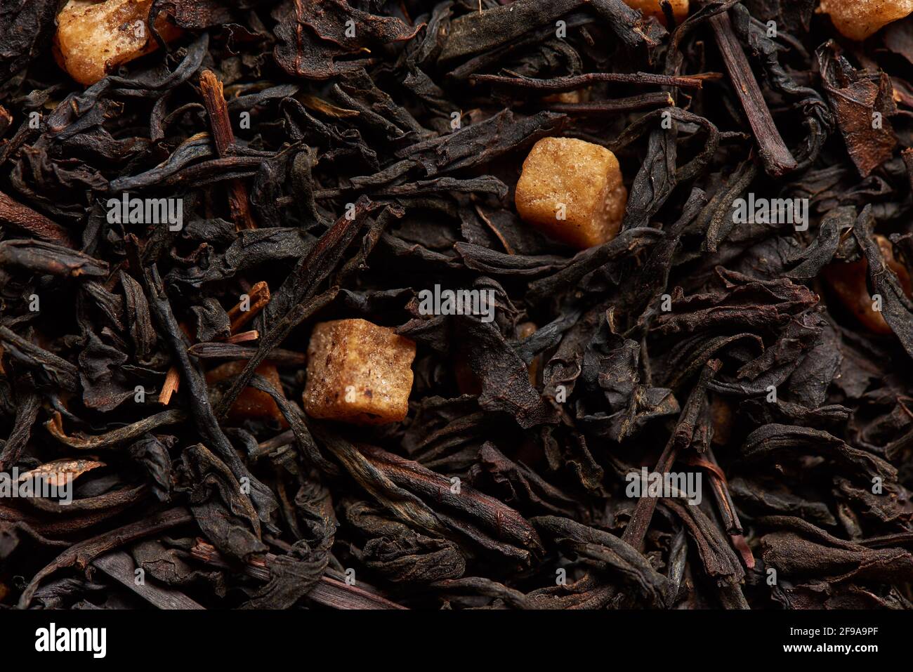 Tea leaves texture with nuts as a background Stock Photo - Alamy