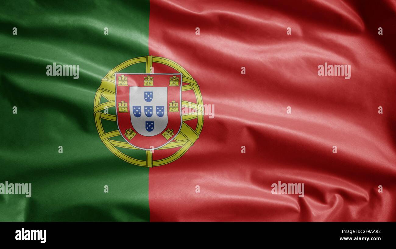 Portuguese flag waving in the wind. Close up of Portugal banner blowing ...