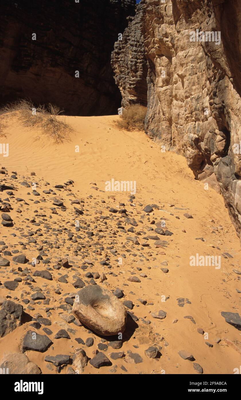 Neolithic saddle quern grinding stone in situ, Tassili N'Ajjer, South ...