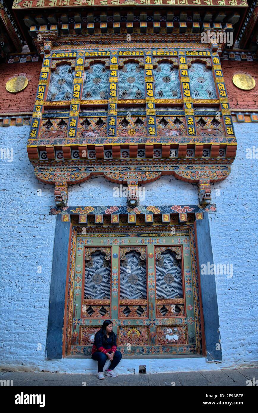 the Dzong is beautifully decorated with carved woodwork and colourful ...
