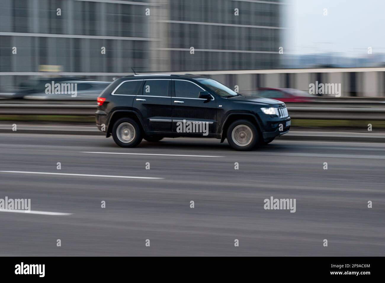 Ukraine, Kyiv - 11 March 2021: Black Jeep Grand Cherokee car moving on ...